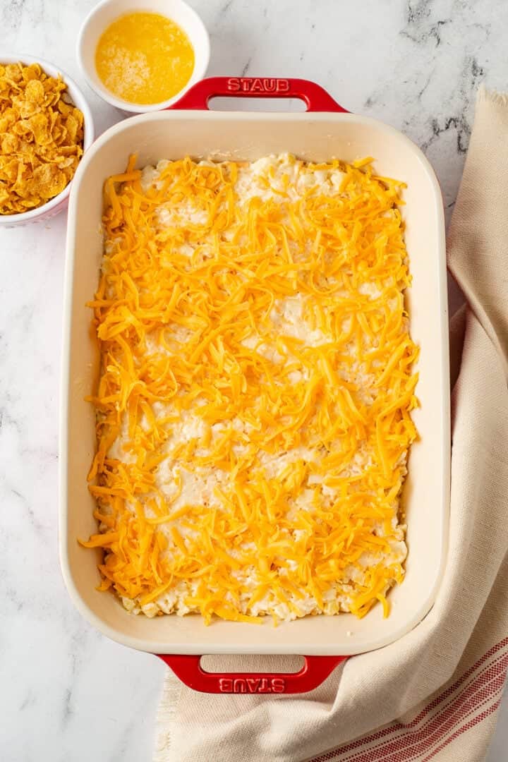 Cheesy Hashbrown Casserole with Corn Flakes Topping | She's Not Cookin'